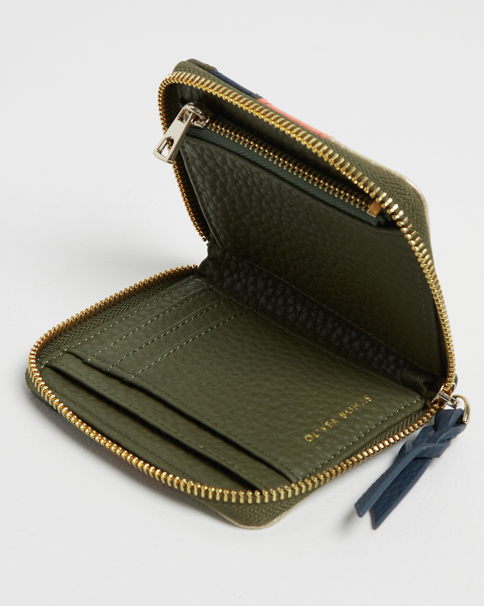 Curved Swirl Khaki Green Zipped Purse | Oliver Bonas