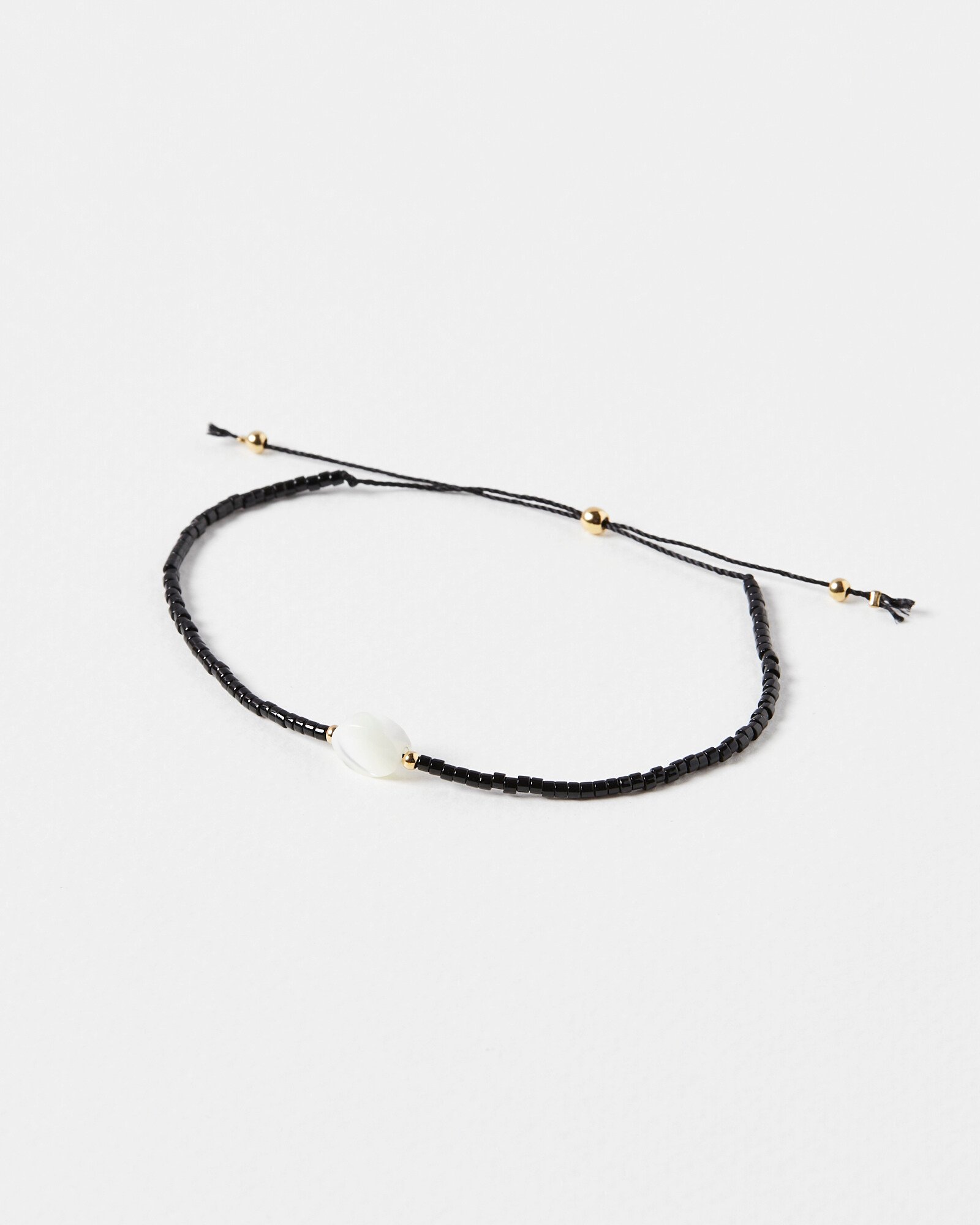 Casper Shell & Black Glass Bead Cord Bracelet | Oliver Bonas