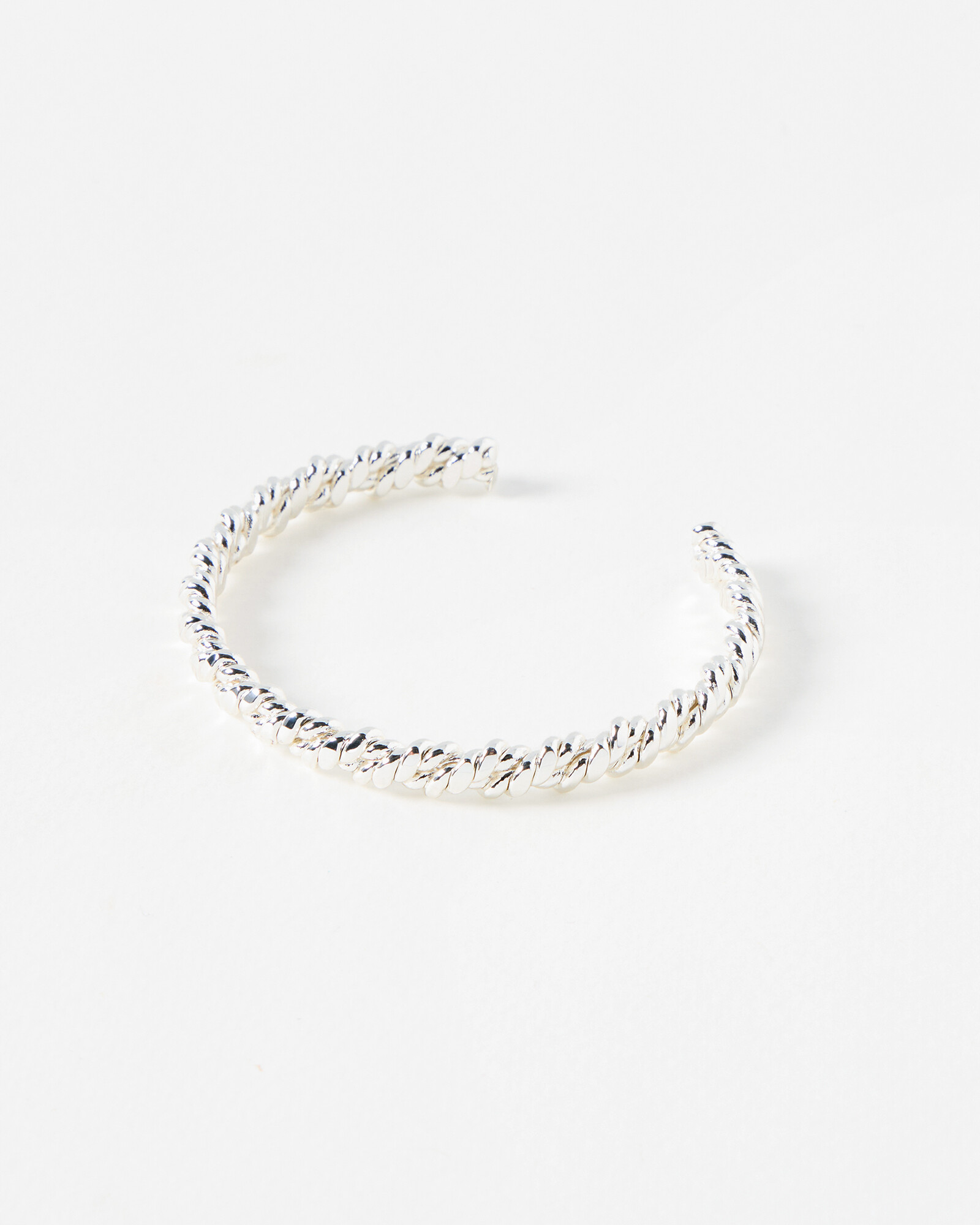 Dovie Twisted Silver Tone Bangle | Oliver Bonas