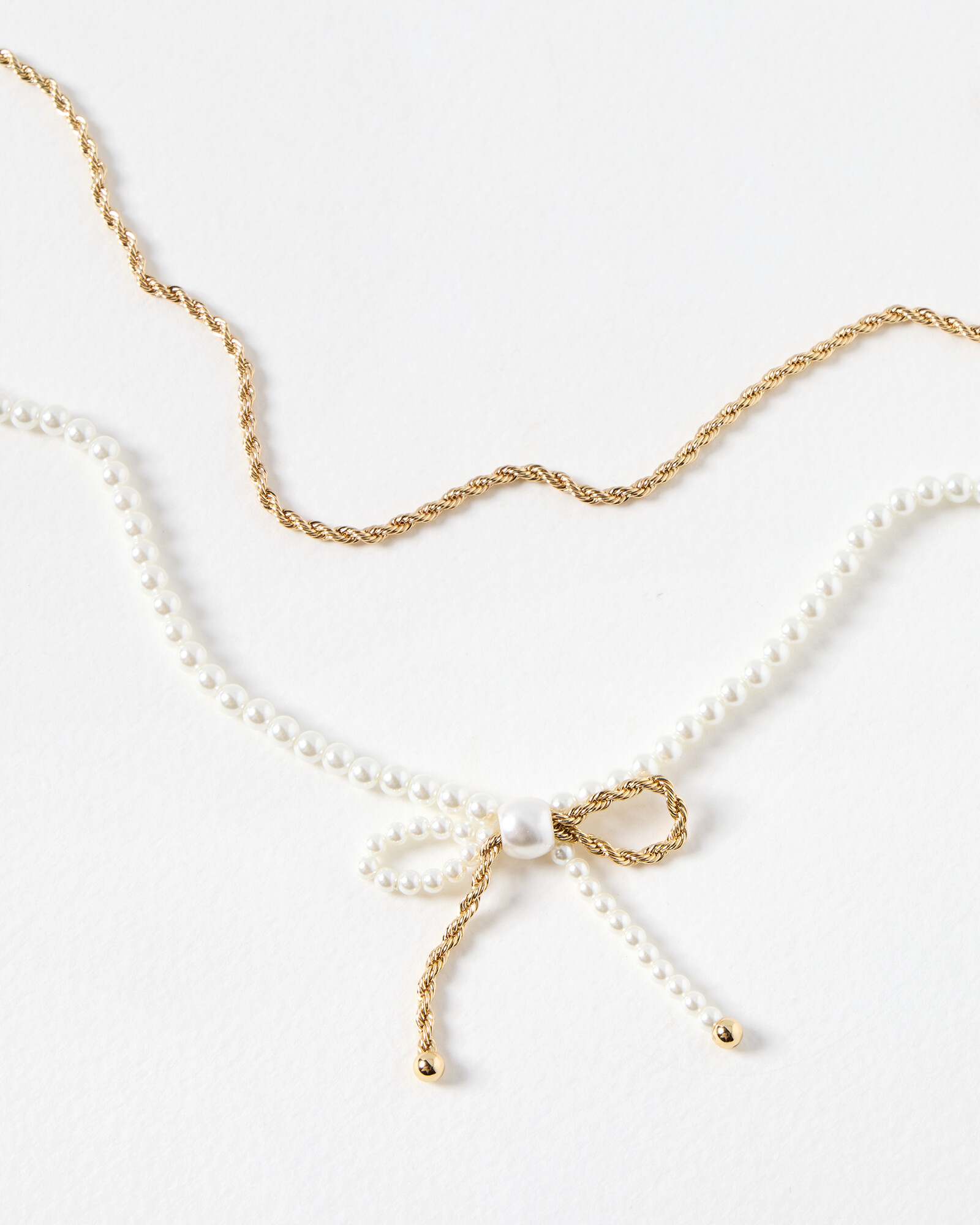 Cece Rope Chain & Faux Pearl Bow Layered Necklace | Oliver Bonas