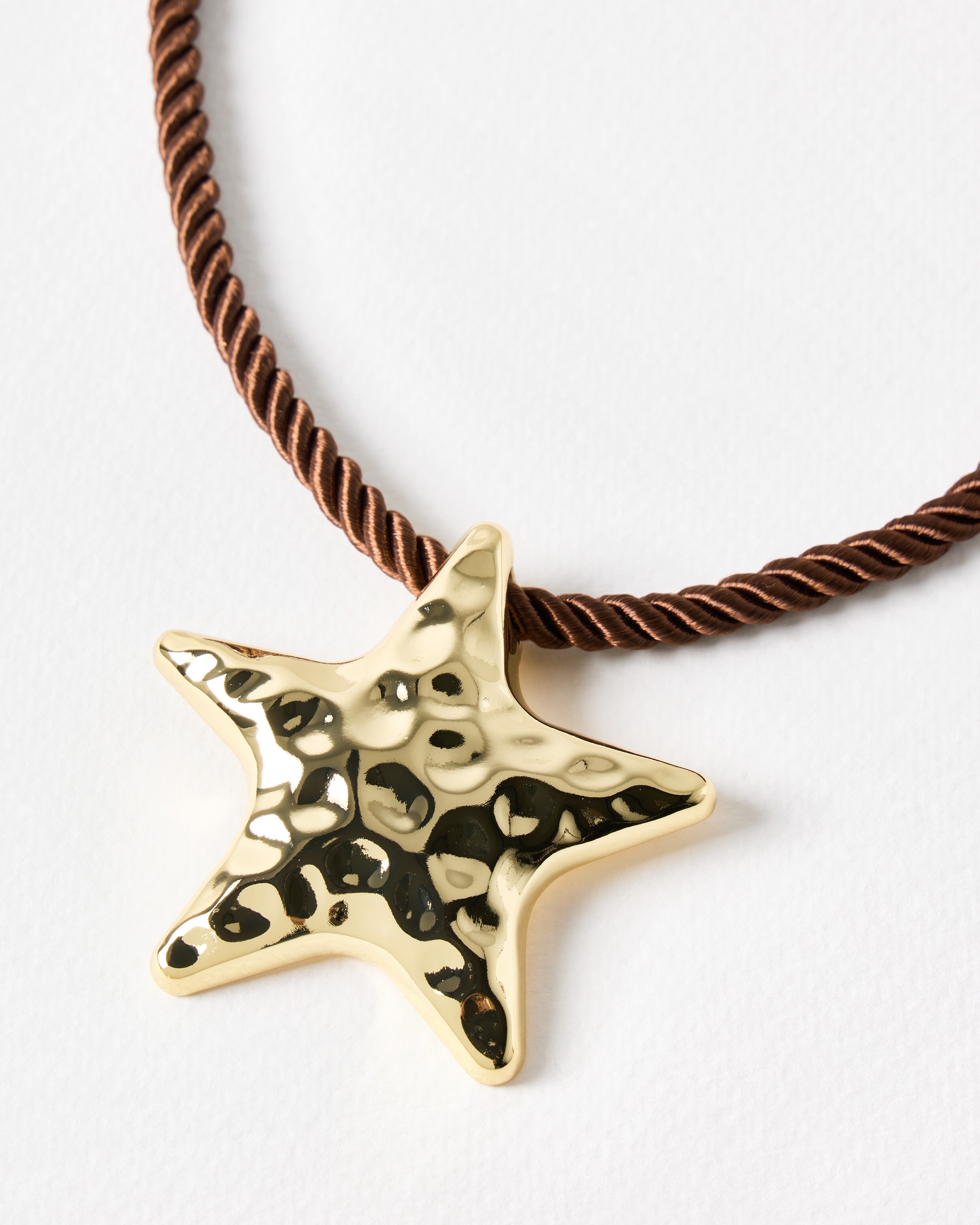 Beryl Gold Tone Star Brown Cord Necklace | Oliver Bonas